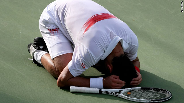 Djokovic defends Dubai title despite Youzhny comeback - CNN.com